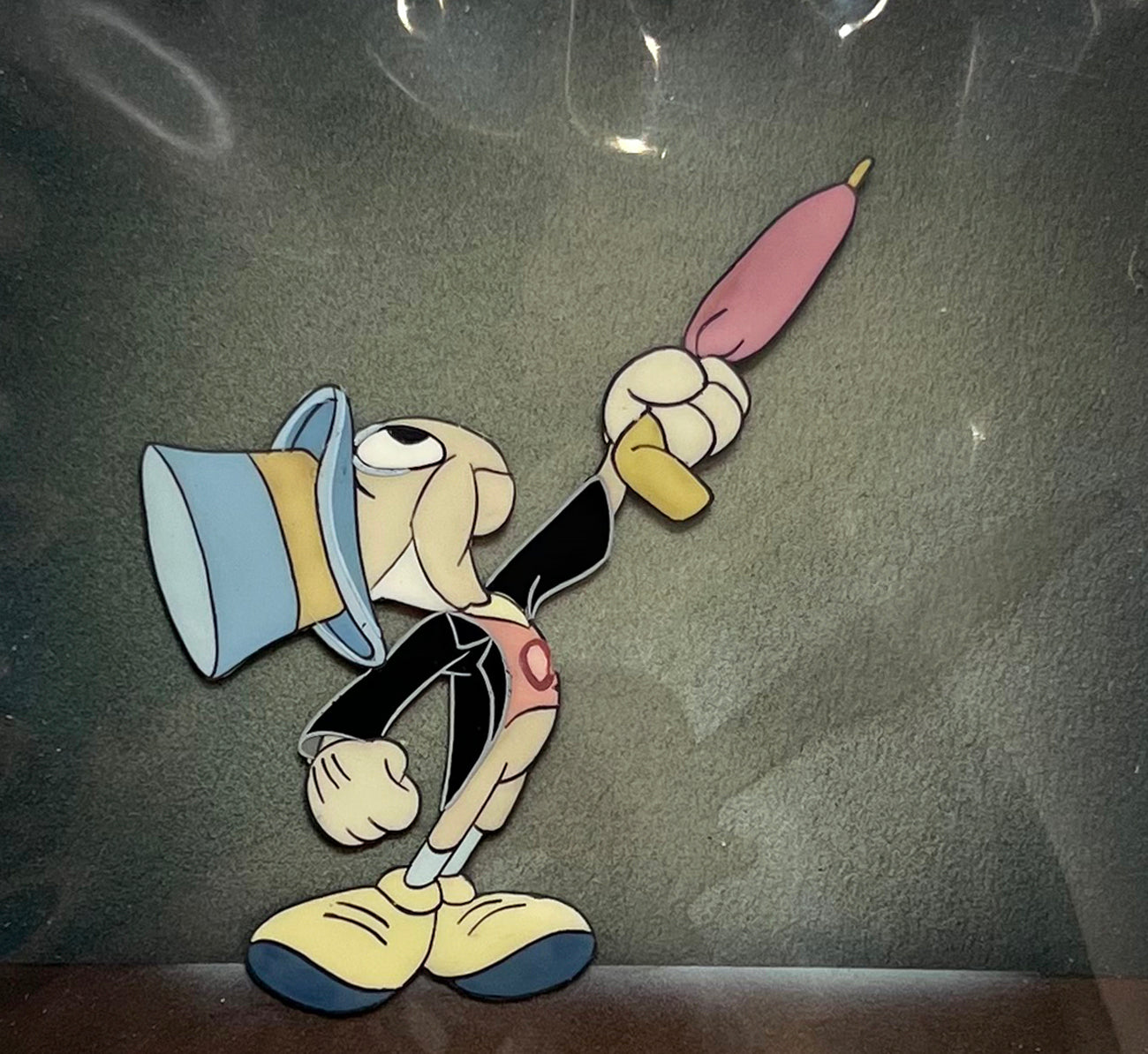 Original Walt Disney Production Cel on Courvoisier Background from Pinocchio featuring Cleo ...